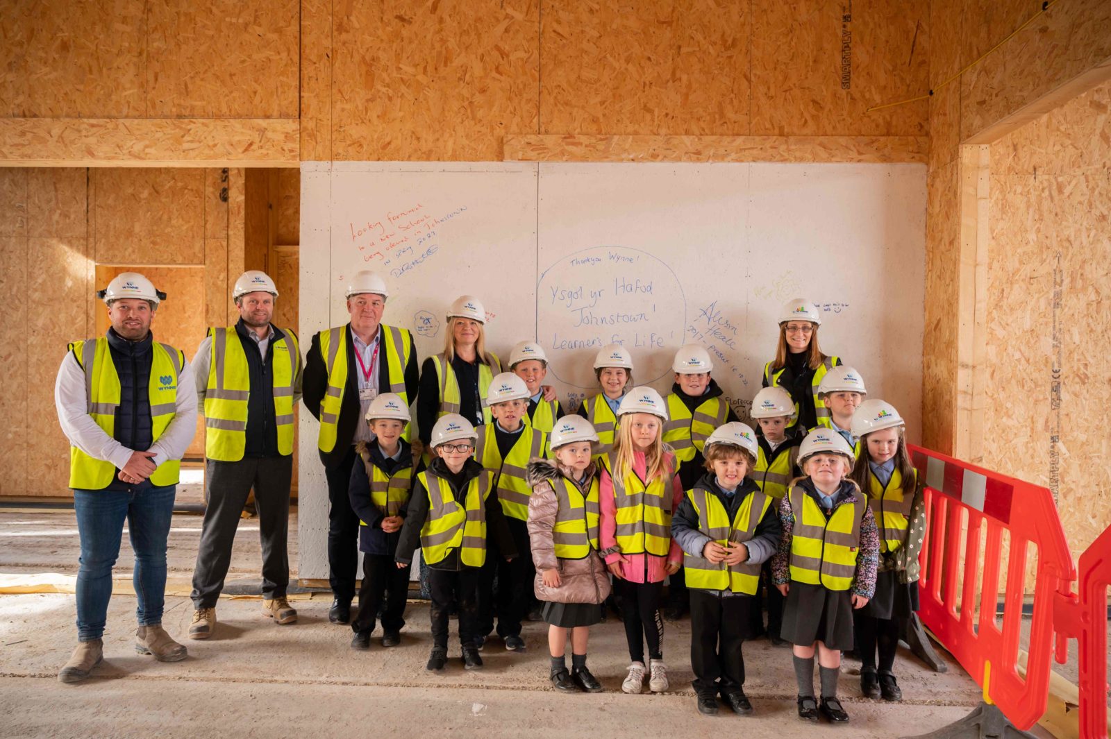Pupils sign their names into history as Wrexham school reaches milestone