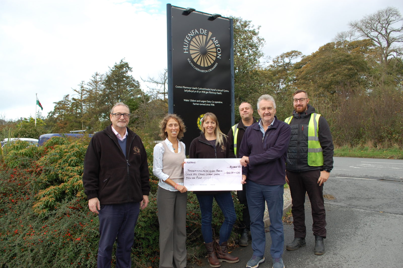 Big-hearted creamery workers raise mountain of cash on Snowdon trek